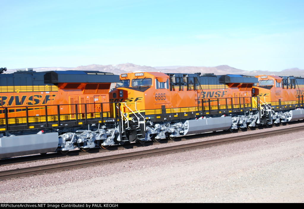 BNSF 6885 with the rear of the Leader BNSF 6888 showing and the nose of BNSF 6887 behind her.